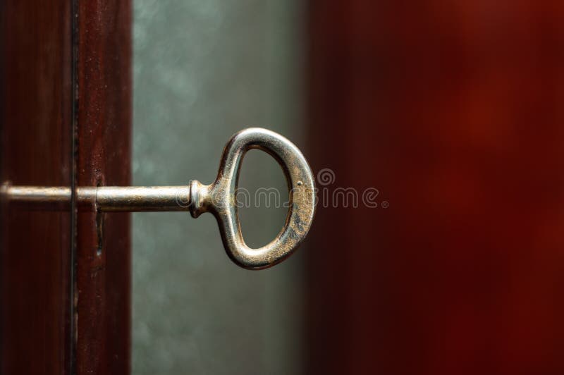 Gilded Key in the Lock Hole of a Home Cabinet Stock Image - Image of ...
