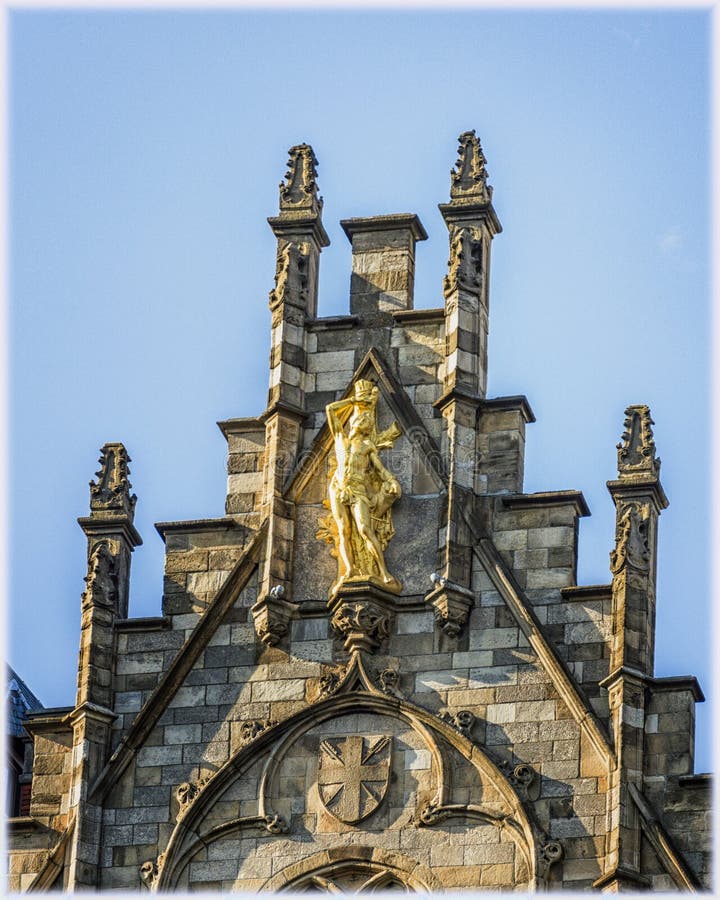 The Gilded Statue on the Top of Guild Houses in Antwerp, Belgium Stock ...
