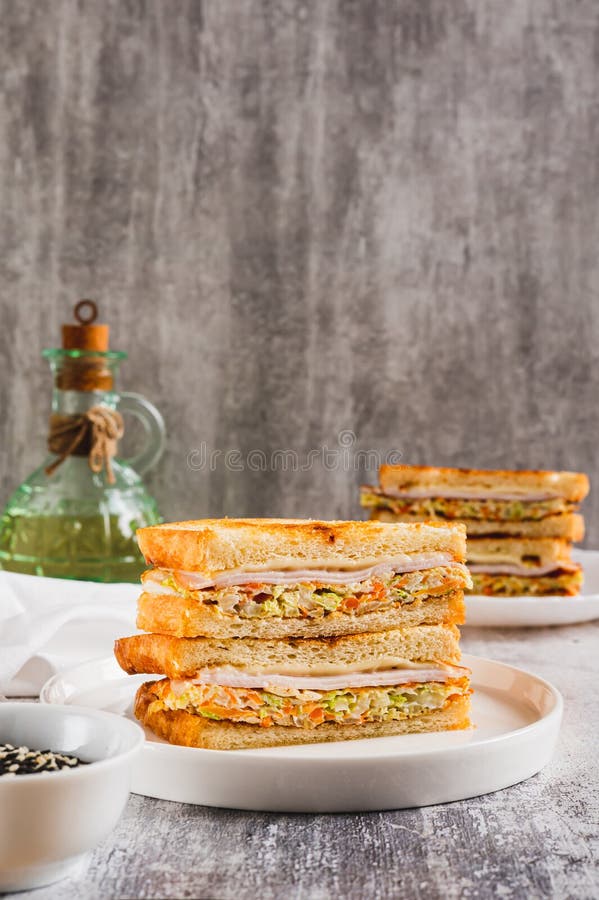 Gilgeori Toast with Cabbage, Carrot, Ham and Cheese on a Plate on the ...