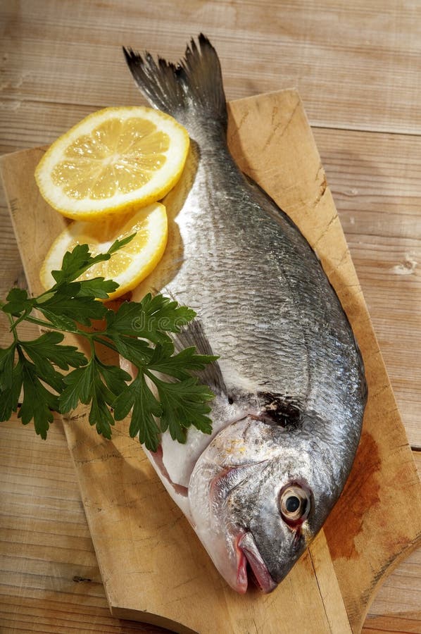Fresh Sea Bream Ready To Cook Stock Photo - Image of parsley, bream ...
