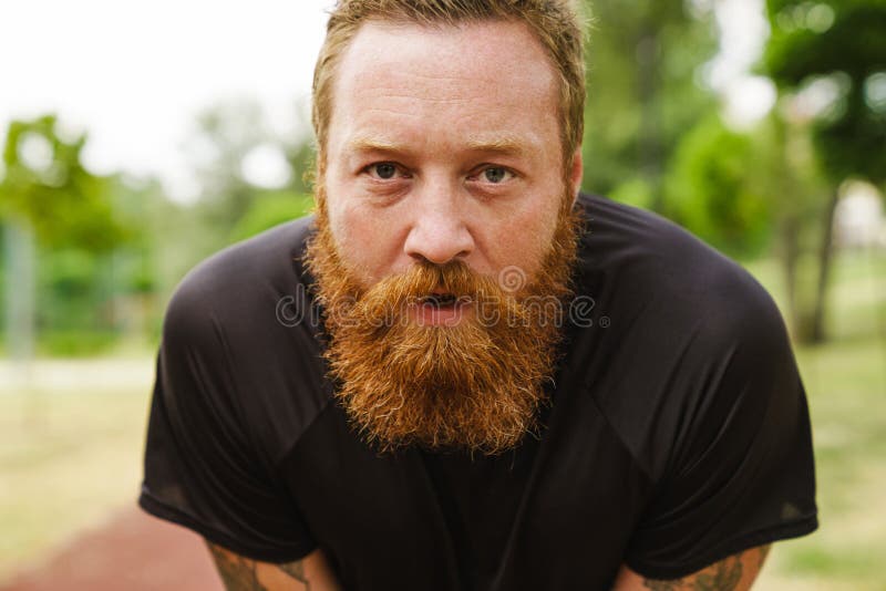 Ginger Bearded Sportsman Resting while Working Out in Park Stock Photo ...