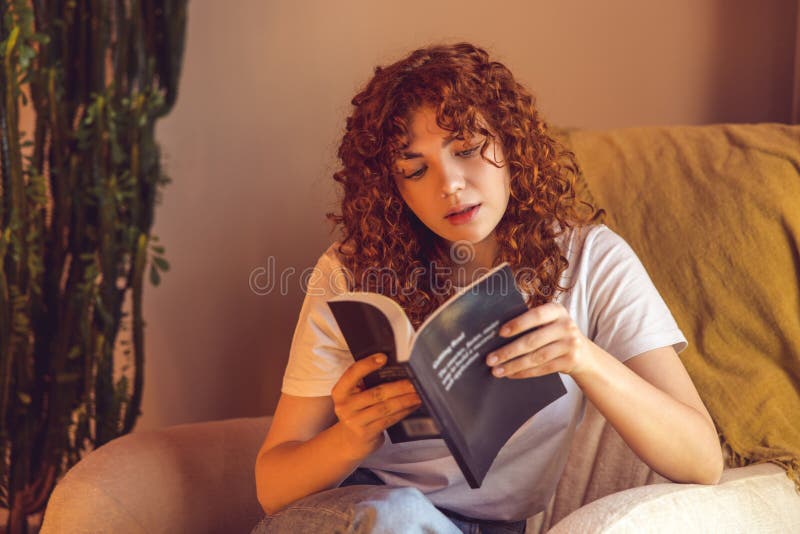 Ginger Curly-haired Girl Reading a Book Stock Photo - Image of ...