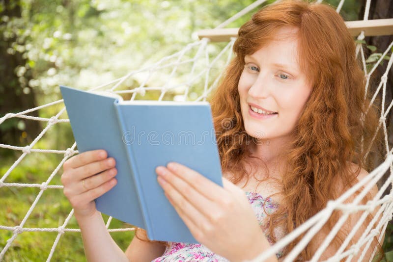 Ginger Girl Reading a Book in a Hammock Stock Image - Image of calm ...