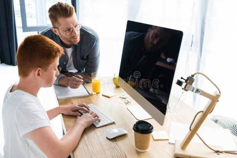 Ginger Hair Father and Son Looking at Computer Stock Image - Image of ...