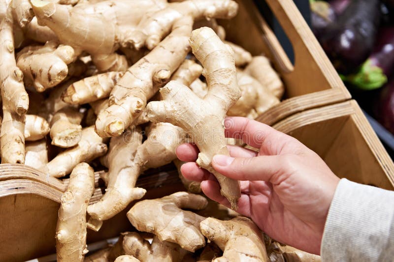 Ginger in Hands of in Store Stock Image - Image of retail, root: 270281687