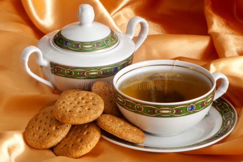 Ginger and Orange Tea and Biscuits Stock Photo - Image of liquid, green ...
