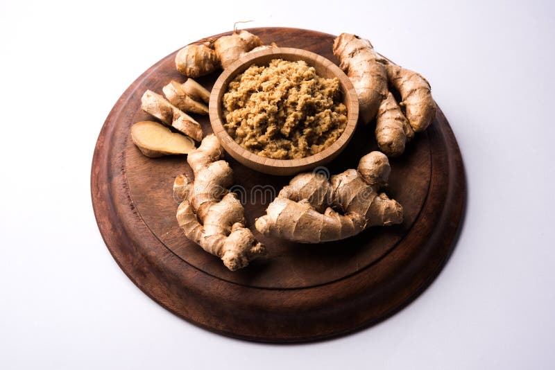Ginger Paste or Puree with Whole Ginger Pieces Over Vwhite Background ...