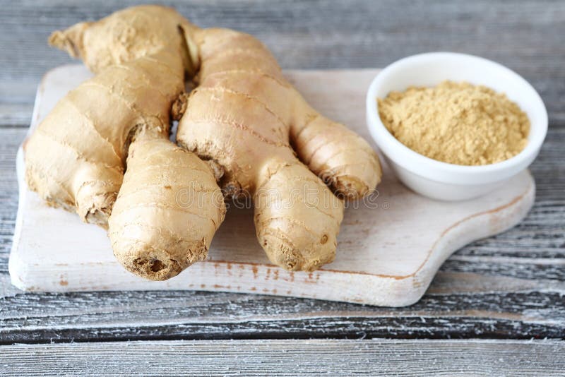 Ginger Root and Ginger Powder in a Bowl Stock Image - Image of board ...