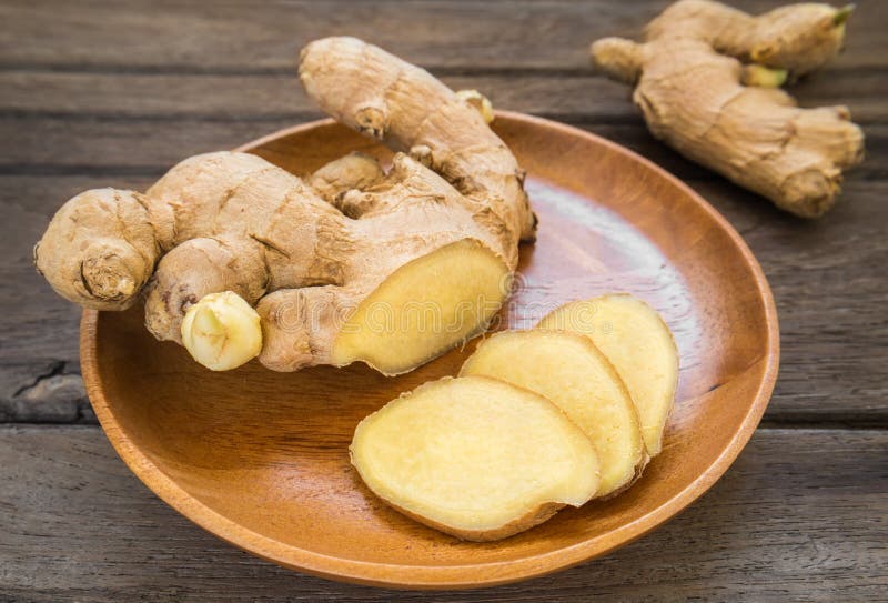 Ginger Root Sliced on Wooden Plate Stock Image - Image of food, slice ...