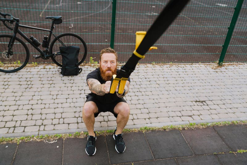 Ginger Sportsman Doing Exercise while Working Out on Playground Stock ...
