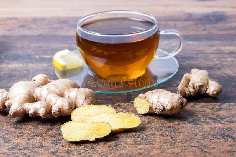 Ginger Tee on Wooden Table with Sliced Lemon Stock Photo - Image of ...