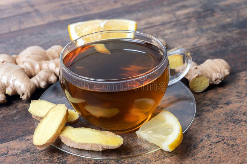 Ginger Tee on Wooden Table with Sliced Lemon Stock Photo - Image of ...