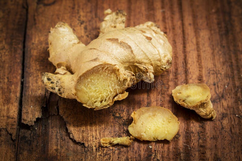 Ginger on wood table stock photo. Image of spice, spicy - 39429396