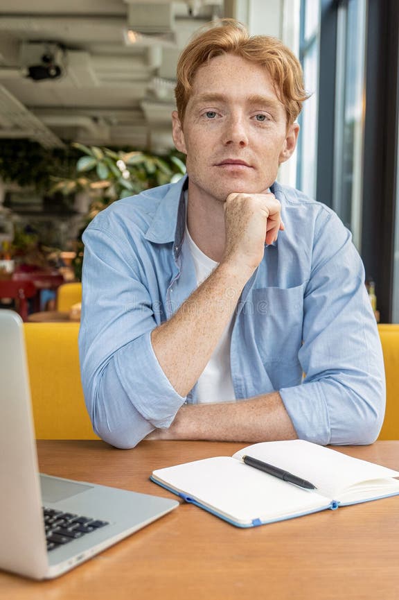 Ginger Young Man Sitting at the Table in the Cafe Stock Image - Image ...