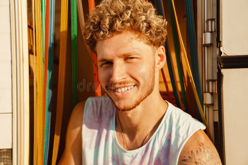 Ginger Young Man Smiling and Looking at Camera while Standing by ...