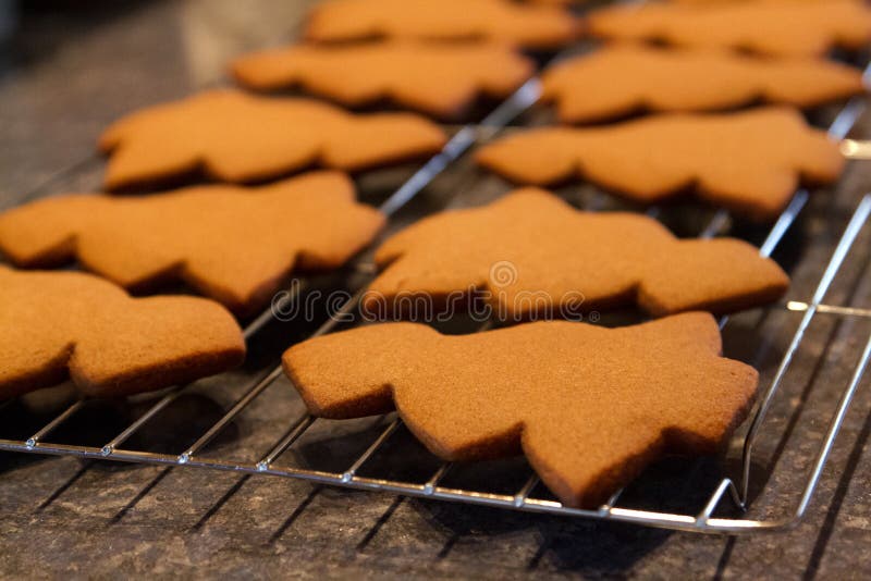 Gingerbread Men on a Wire Rack on a Wooden Surface. Christmas Cookies ...