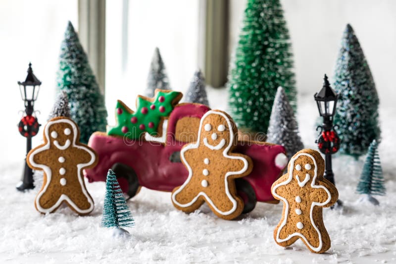 A Gingerbread Cookie Family Harvesting a Tree for the Holidays. Stock ...