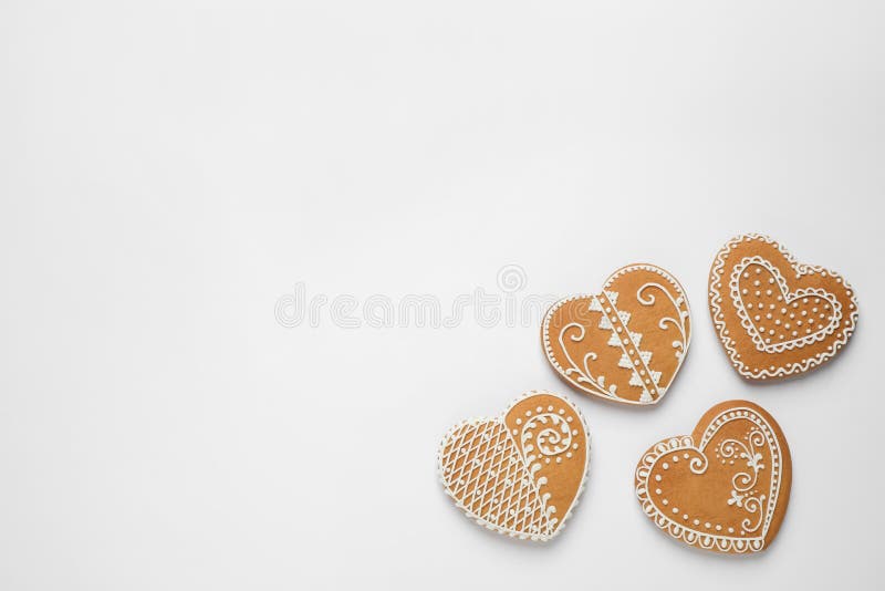 Gingerbread Hearts Decorated with Icing on White Background, Flat Lay ...