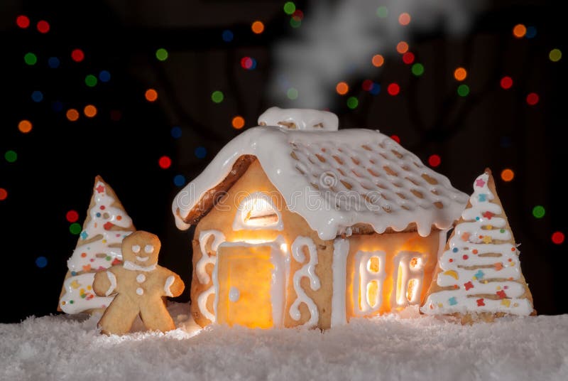 Gingerbread House with Gingerbread Man and Christmas Trees Stock Photo ...