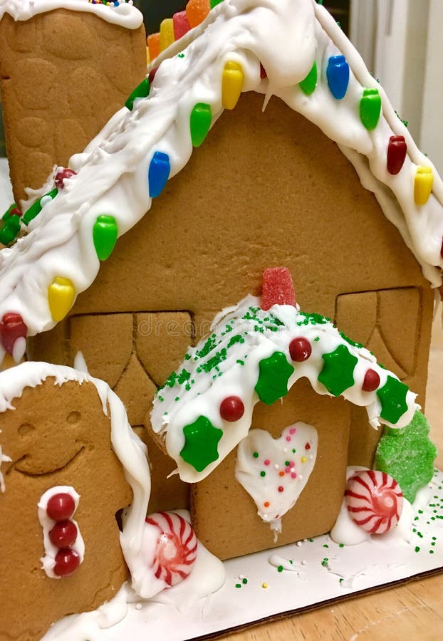 Gingerbread House with Welcoming Cookie Stock Photo - Image of ...