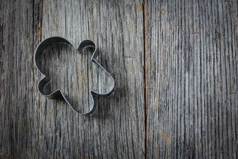 Gingerbread Man Cookie Cutter on Rustic Wood Stock Image - Image of ...