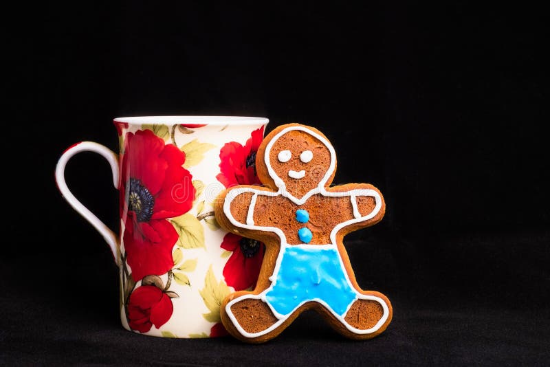 Gingerbread Man and Cup of Tea on Black Velvet Stock Image - Image of ...