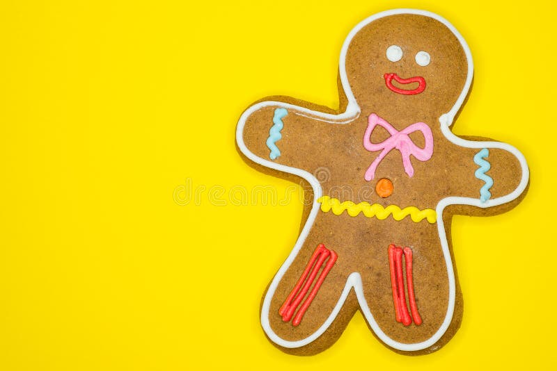 Gingerbread Man Decorated with Colored Icing Isolated on Yellow ...