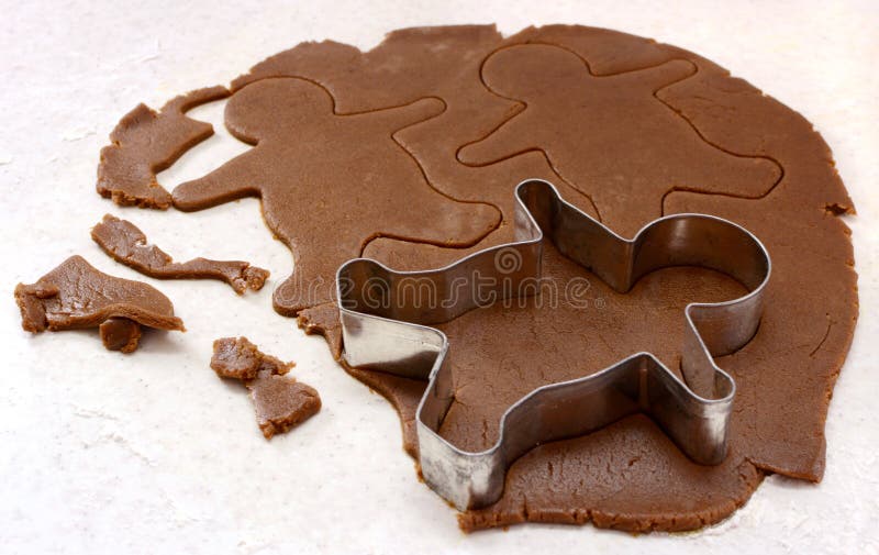 Gingerbread Man Shapes in Cookie Dough Stock Photo - Image of still ...