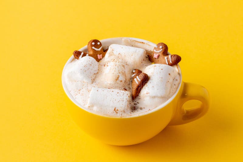 Gingerbread Men in Yellow Cup of Latte with Marshmallow Stock Image ...