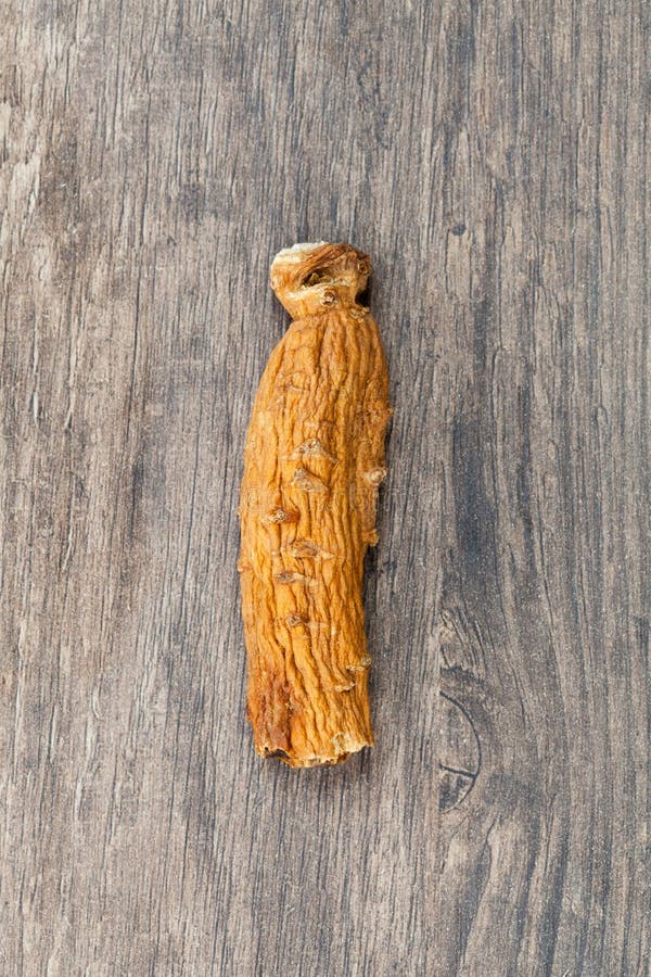 Ginseng on wood table stock photo. Image of east, medical - 50307578