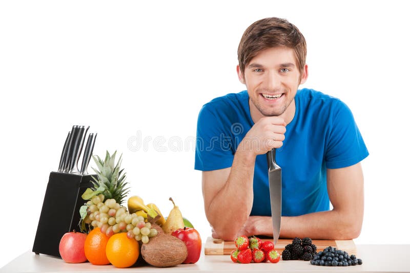 Giovane Che Si Appoggia Tavola Con Il Coltello Fotografia Stock ...