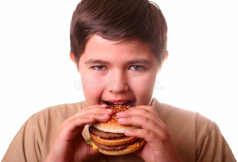 Ragazzo Che Mangia Un Hamburger Fotografia Stock - Immagine di alimento ...