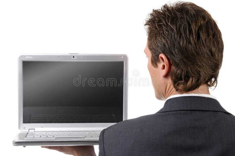 Giovane Uomo D'affari Che Guarda in Computer Portatile Immagine Stock ...