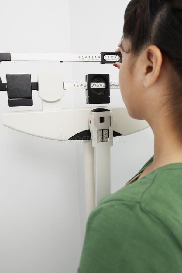 Girl Adjusting Balance Weight Scale Stock Image - Image of measurement ...