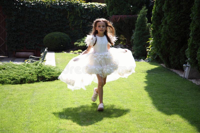 Girl Alice. Little Alice Runs Along the Grass. Stock Photo - Image of ...