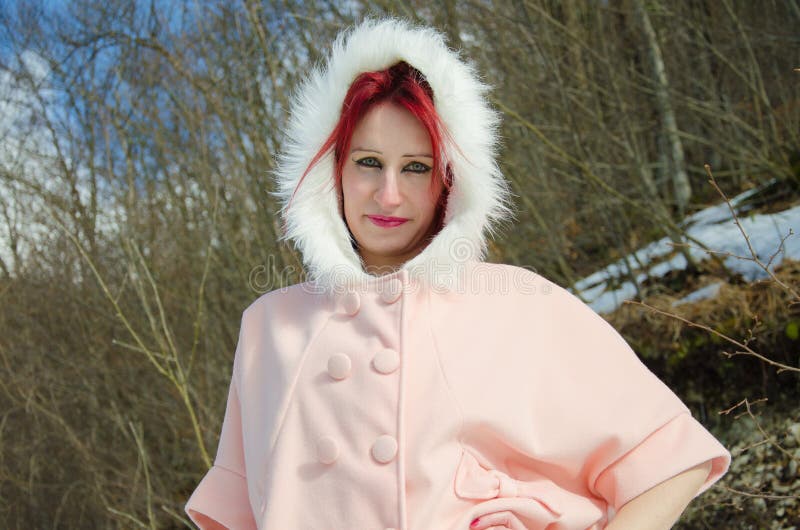 Girl Alone in the Snow with Pink Cape Stock Photo - Image of ...