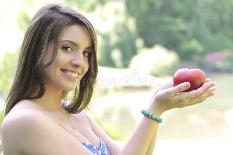 The Girl is Holding the Apple Stock Image - Image of happiness ...
