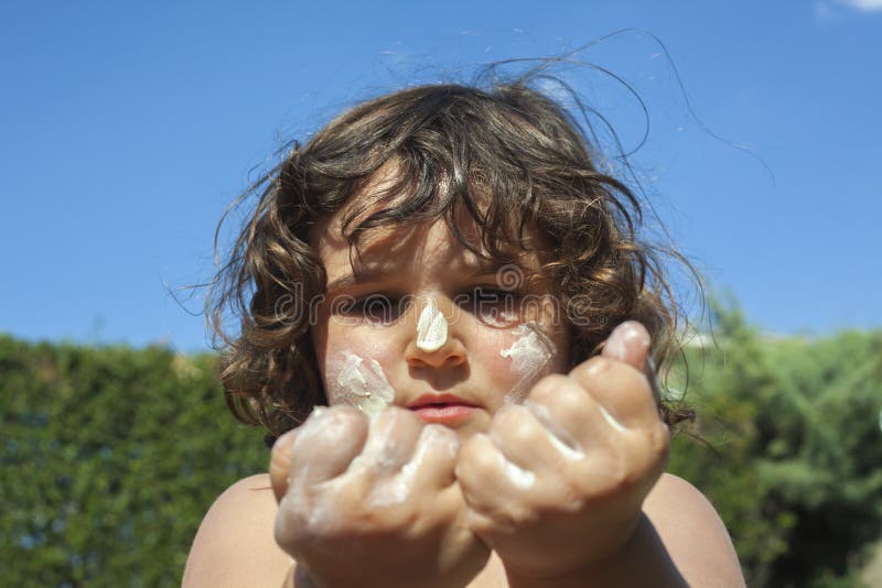 Girl applying lotion. stock image. Image of cream, fingers - 68900629
