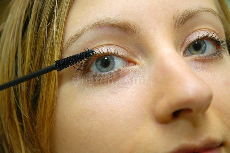 Girl applying make up stock photo. Image of beauty, cosmetics - 930632