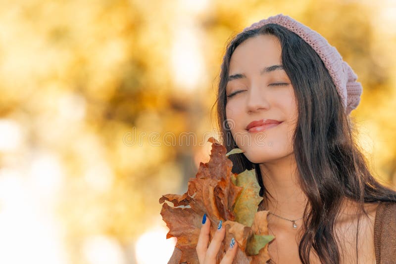 Girl in autumn with leaves stock photo. Image of enjoy - 258981396