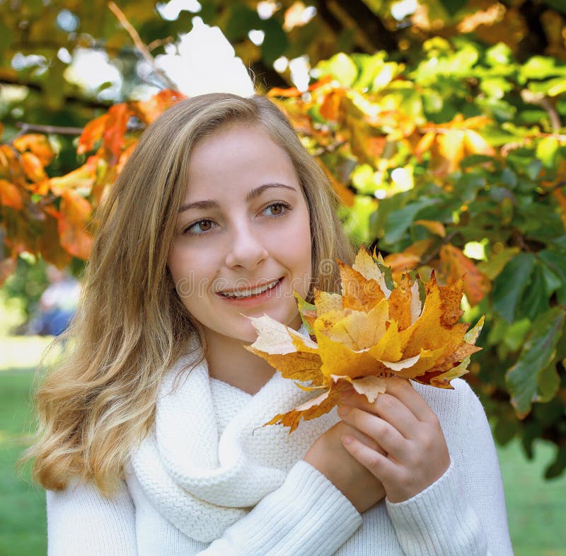 Girl with autumn leaves stock photo. Image of cute, girl - 45764824
