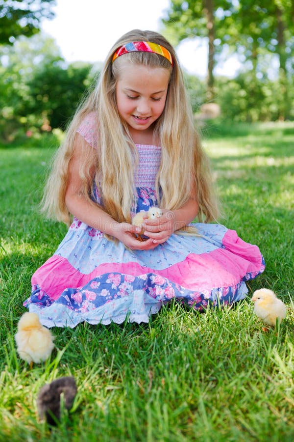 Happy Little Girl Holds a Chicken in His Hands. Child with Poul Stock ...