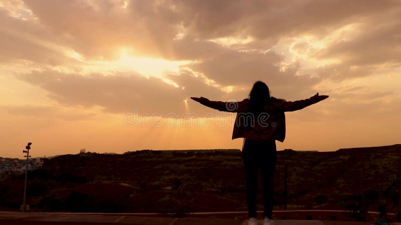 Girl Backlit Shot with Sunset Dramatic Sky with Sun Beams with Dark ...
