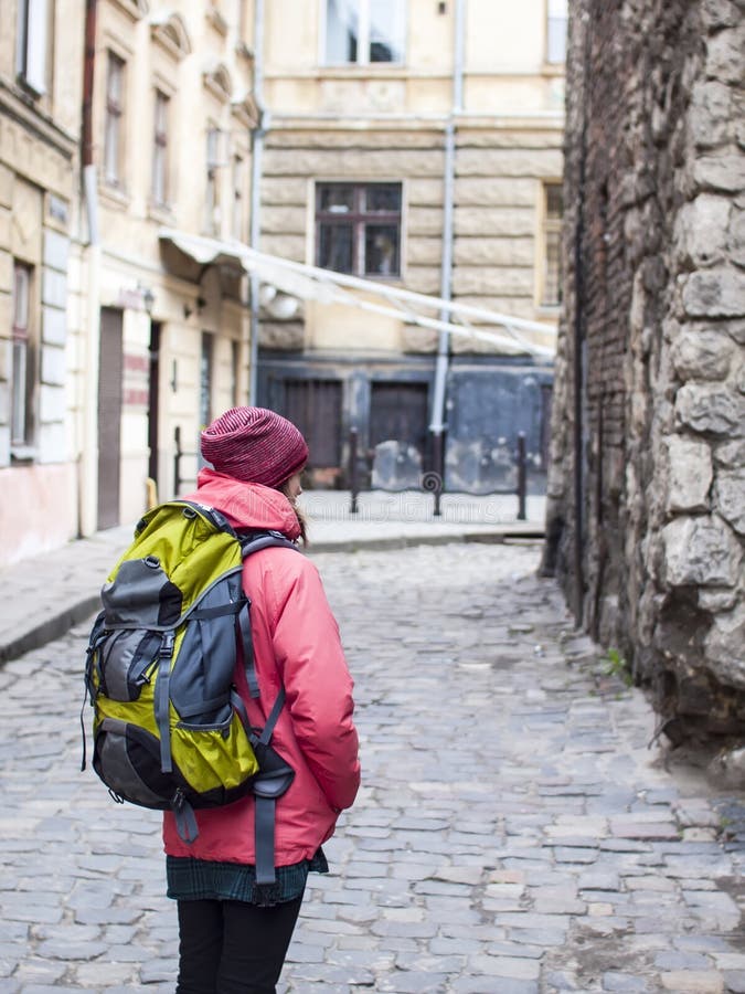 Girl with a Backpack Walking Around the Old Town. Stock Image - Image ...