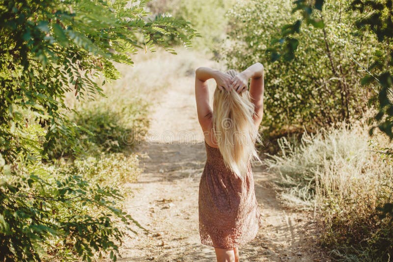 Girl Backs in the Autumn Forest. Bright Colors of Crimson Bushes and ...