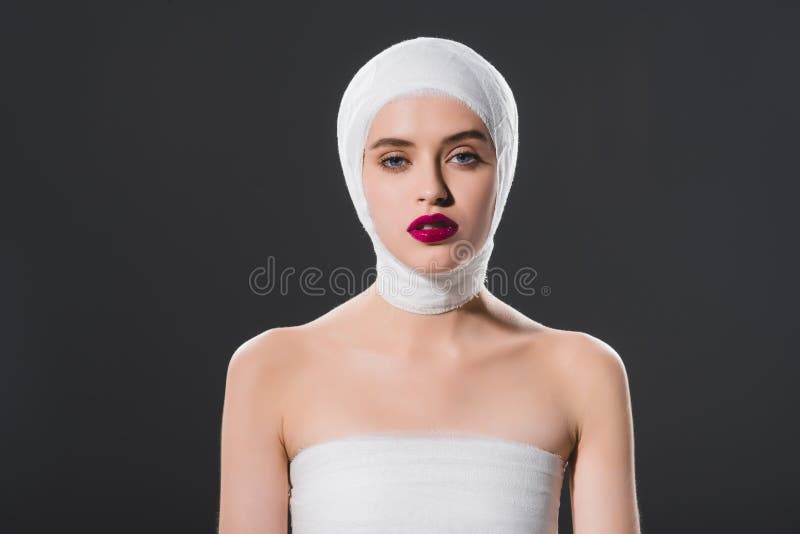Girl with Bandaged Head Isolated on Grey Stock Image - Image of ...