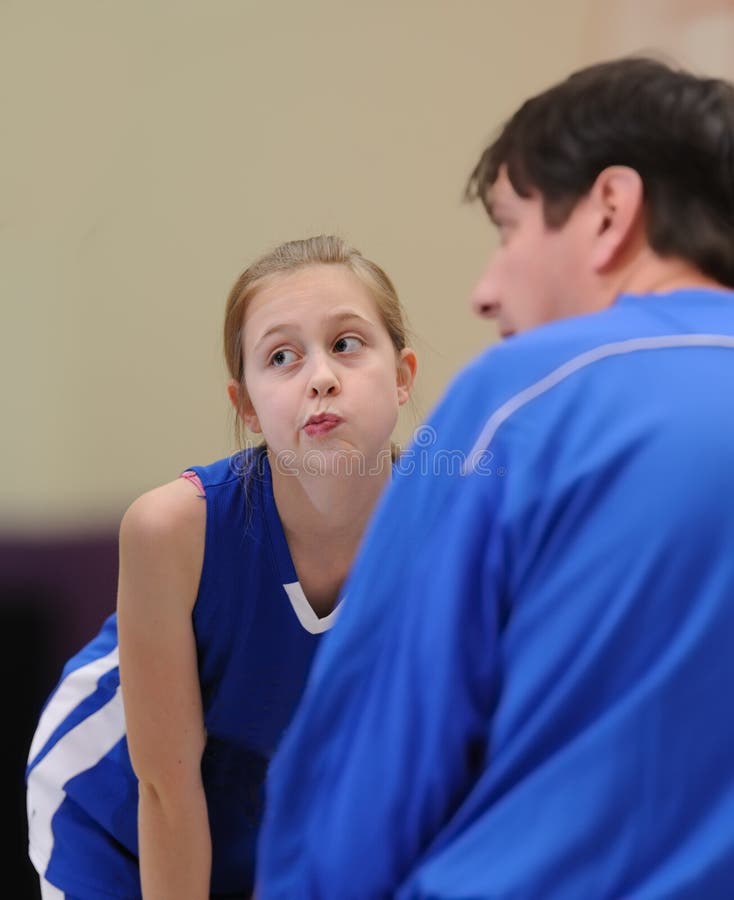Girl in basketball huddle stock image. Image of school - 12588015