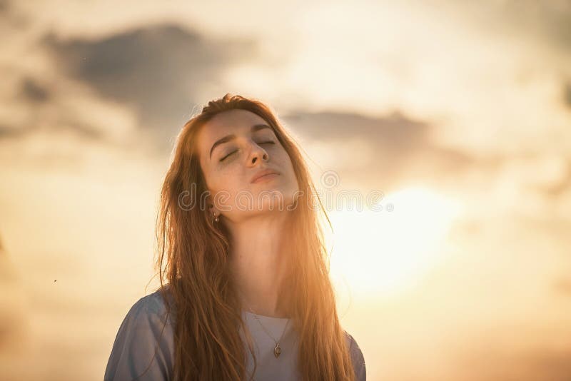 Girl basking in the sun stock photo. Image of health - 81053622