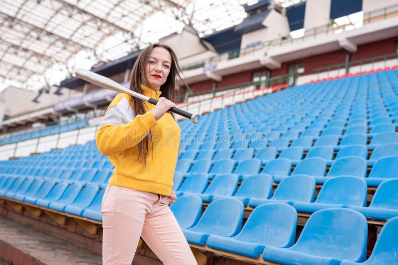 Girl with a Bat in an Empty Stadium Stock Photo - Image of girl ...