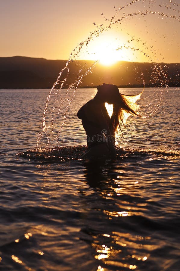 Girl Bathing at Sunset stock image. Image of blonde, bikini - 20478581